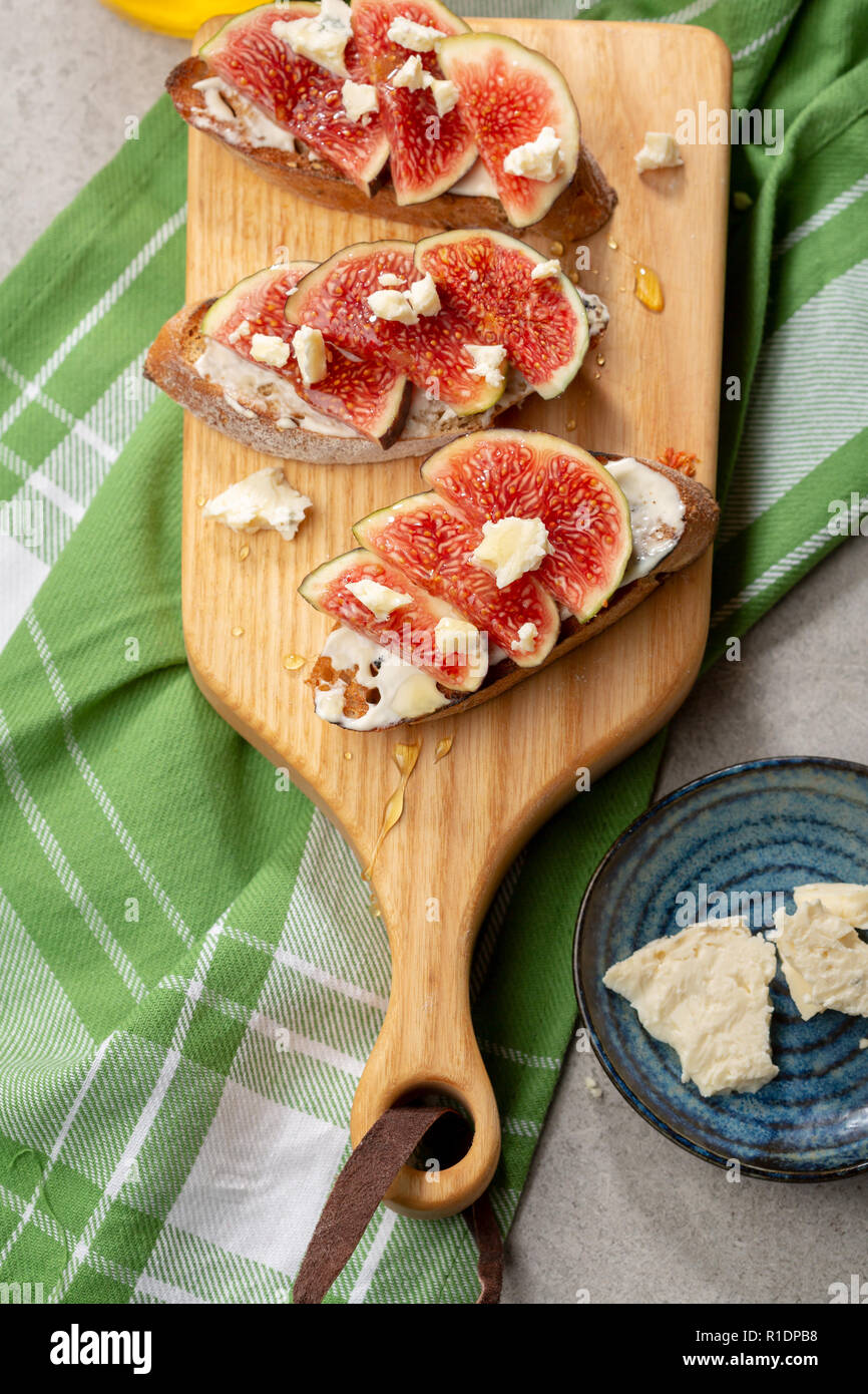 Figs and cheese canapes top view Stock Photo - Alamy