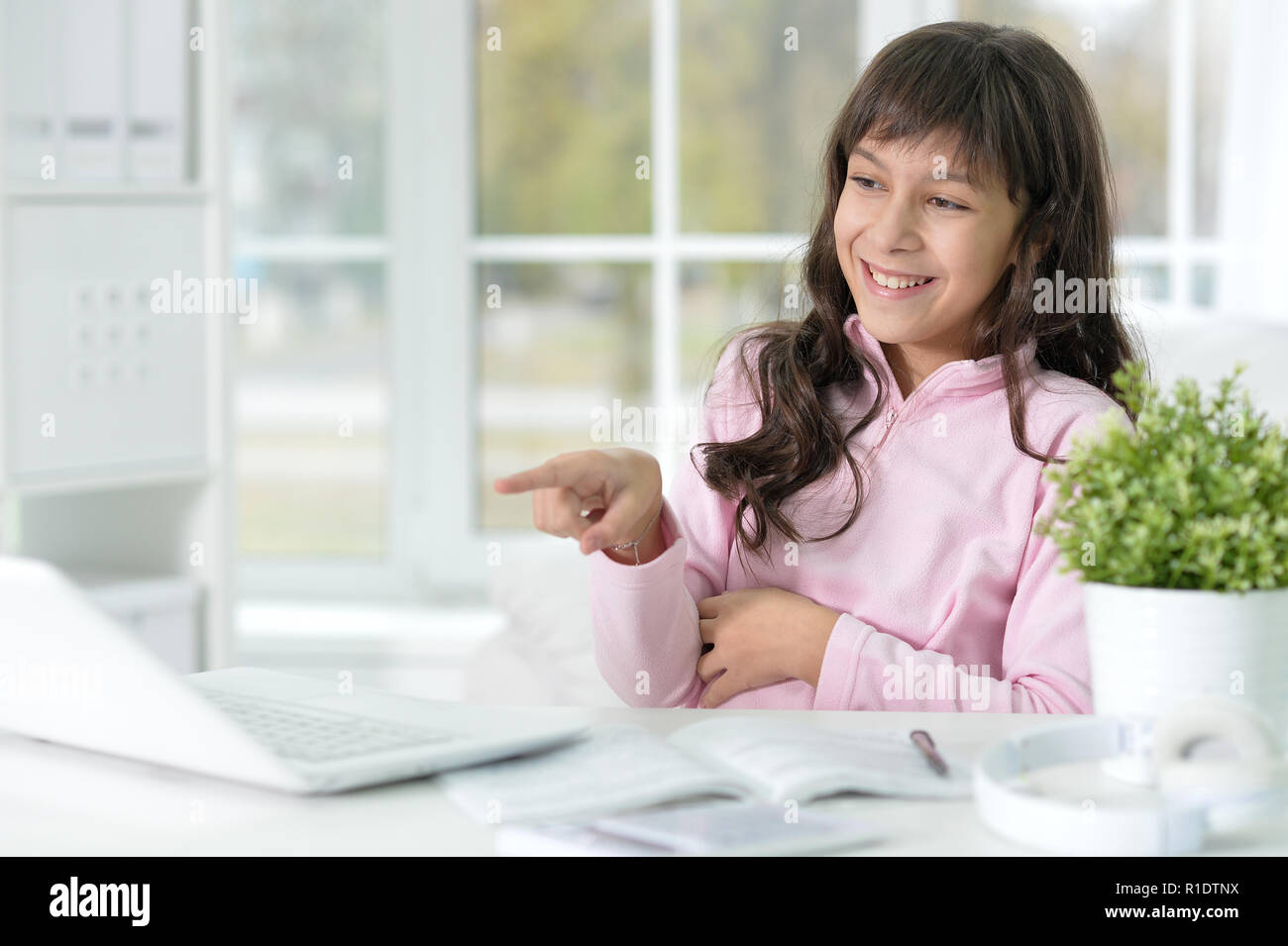 Portrait of a beautiful girl with laptop Stock Photo - Alamy