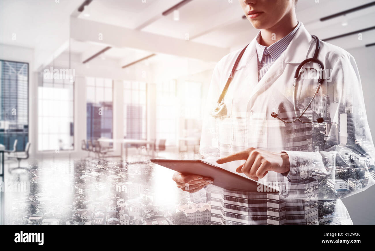 Successful doctor and modern technologies Stock Photo - Alamy