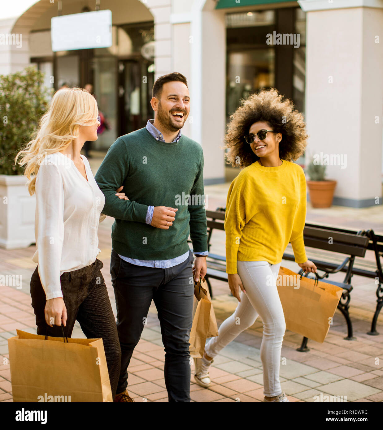 Group of young multiracial friends shopping in mall together Stock ...