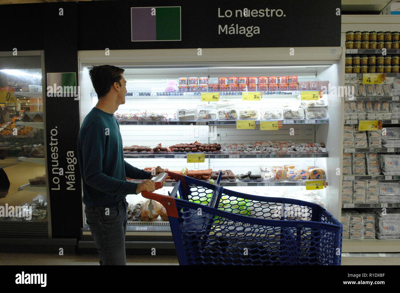 a customer going through local product section Stock Photo - Alamy