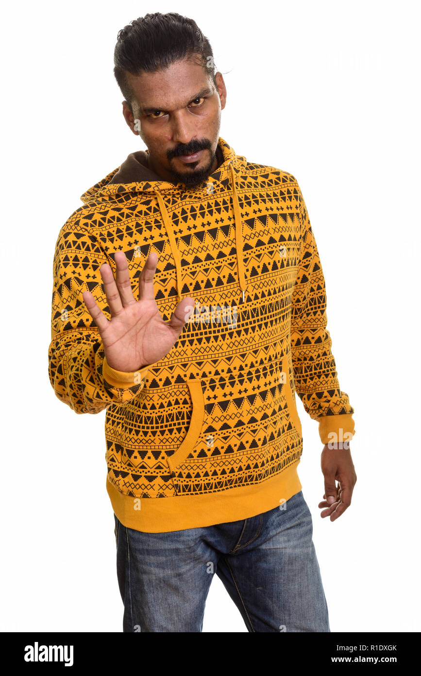 Young Indian man with stop hand gesture Stock Photo - Alamy