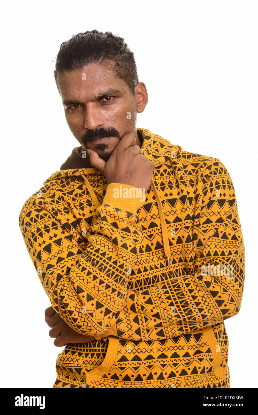 Young Indian man thinking studio portrait against white background ...