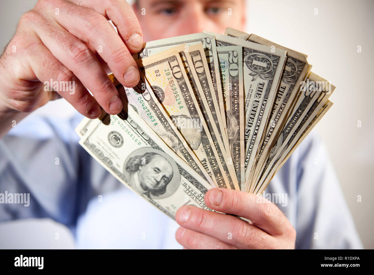 A handful of various denomination US Dollar notes Stock Photo - Alamy