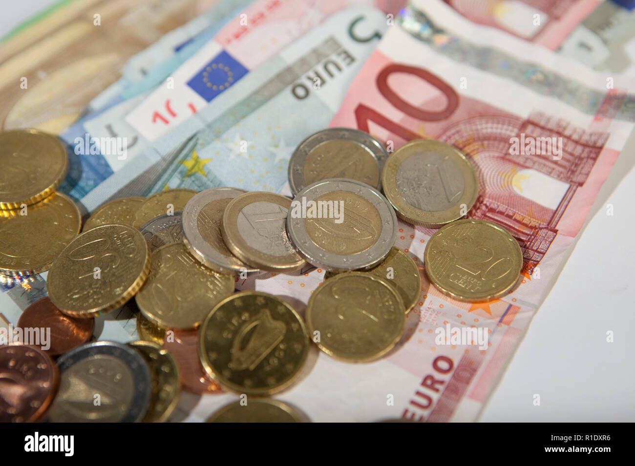 Various denomination Euro notes and coins Stock Photo - Alamy