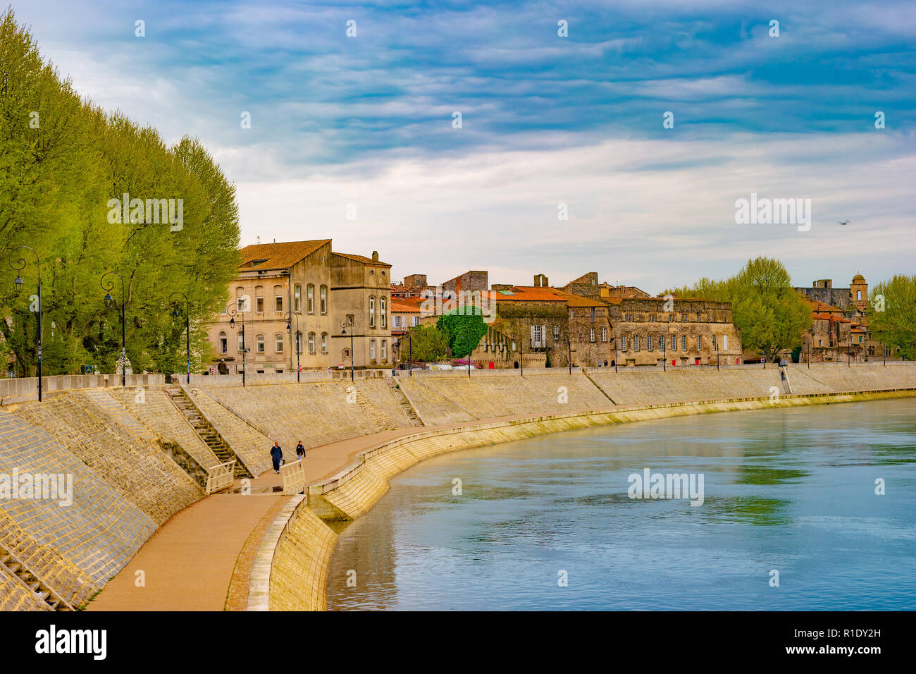 The river Rhone at Arles overlooking the old town. Buches du Rhone ...