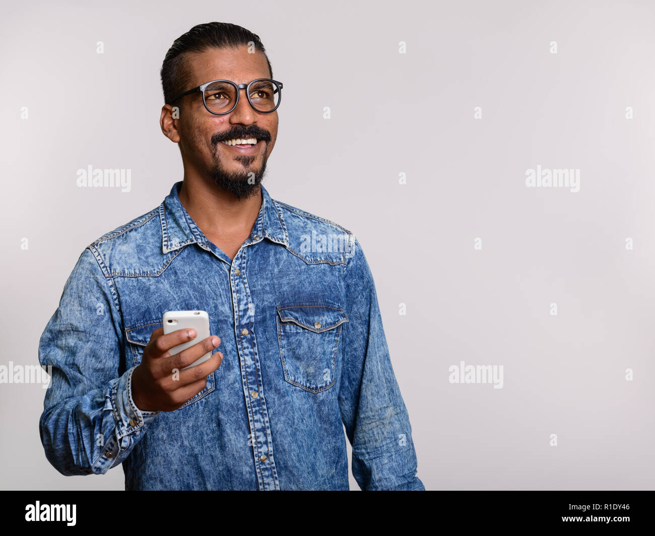 Happy man holding phone hi-res stock photography and images - Alamy