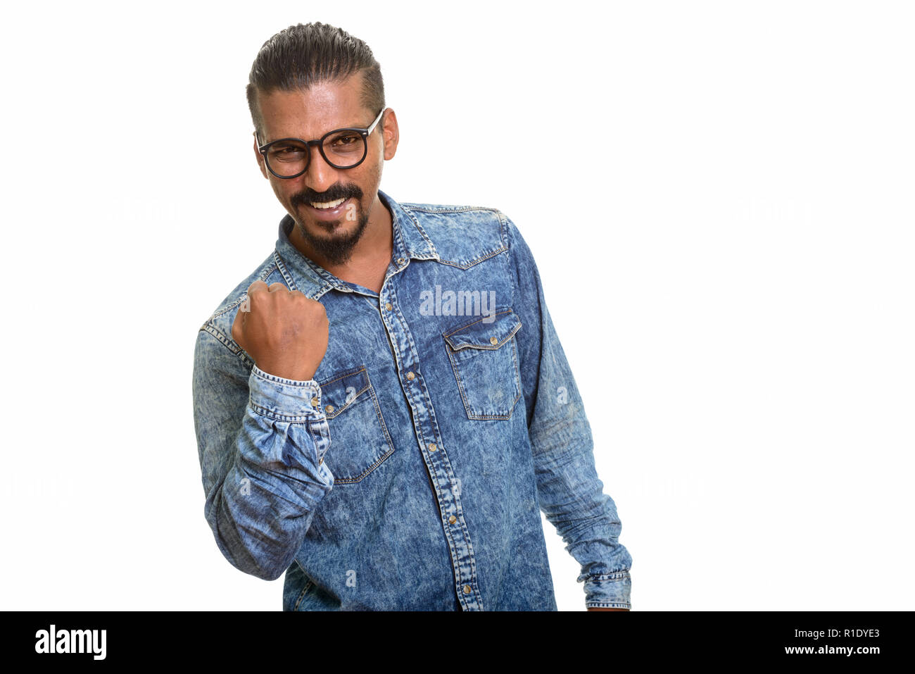 Young happy Indian man looking motivated studio portrait against white ...