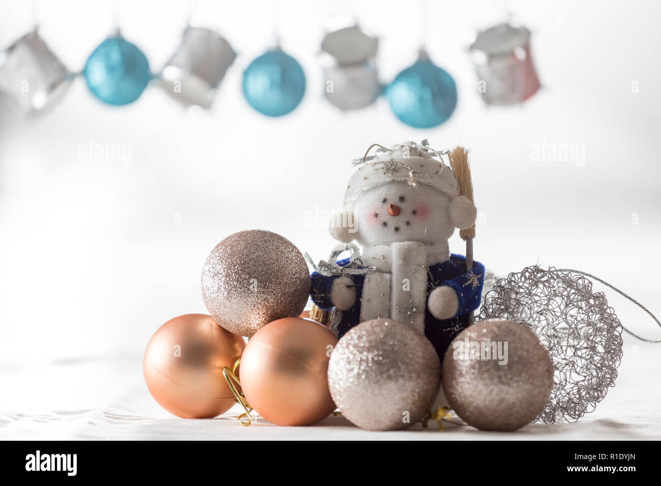 set of Christmas ornaments, blue balls, silver packages and a snowman ...