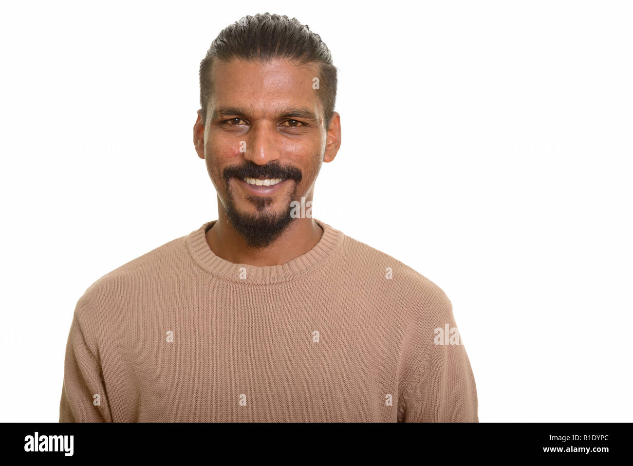 Young happy Indian man smiling studio portrait against white background ...