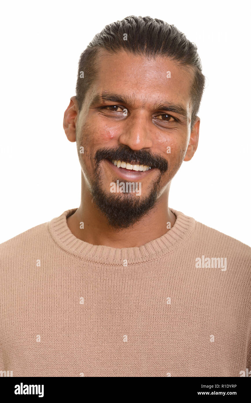 Young happy Indian man smiling studio portrait against white background ...