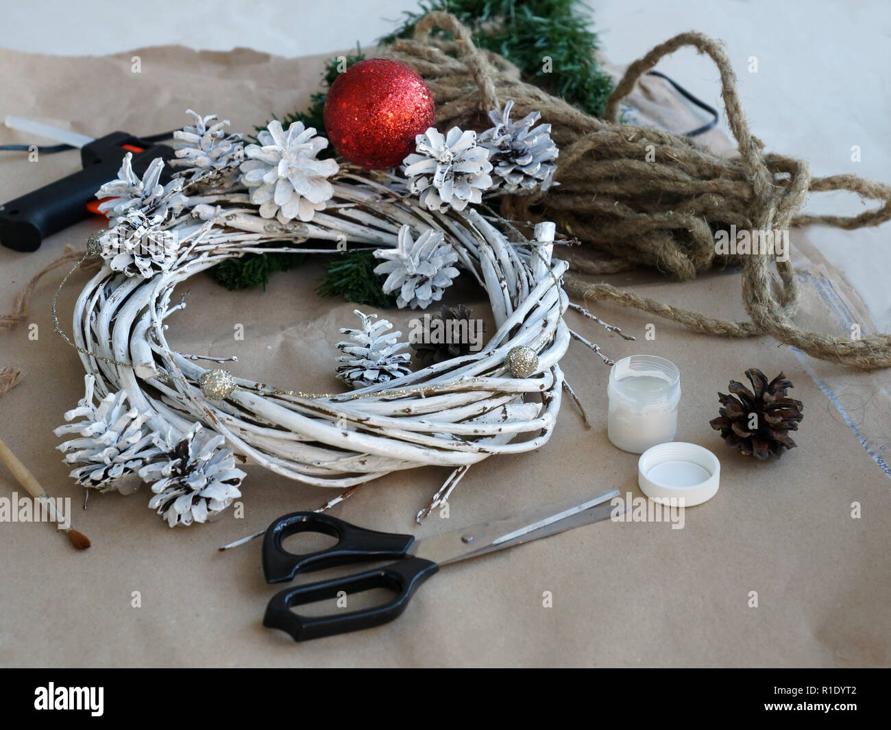 Christmas preparations. The process of making a Christmas wreath with ...