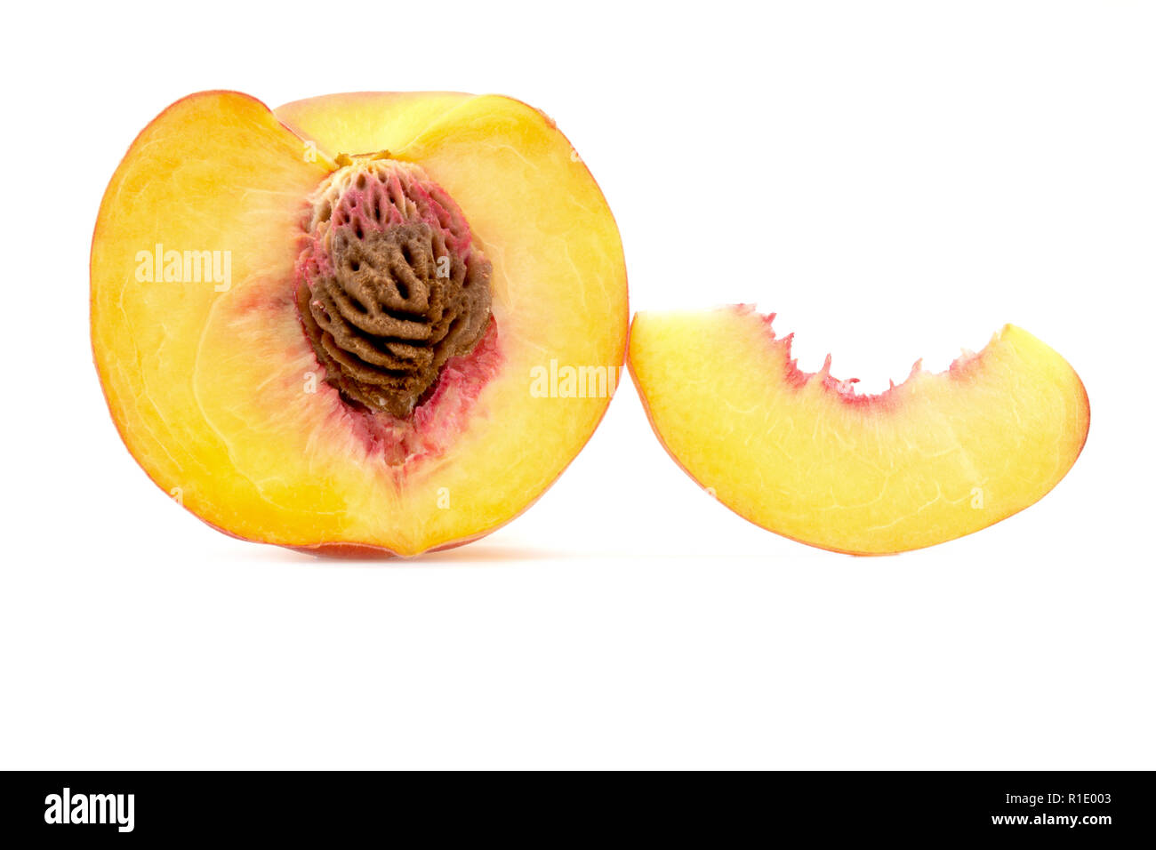 Peach fruit slice close up isolated on white background Stock Photo - Alamy