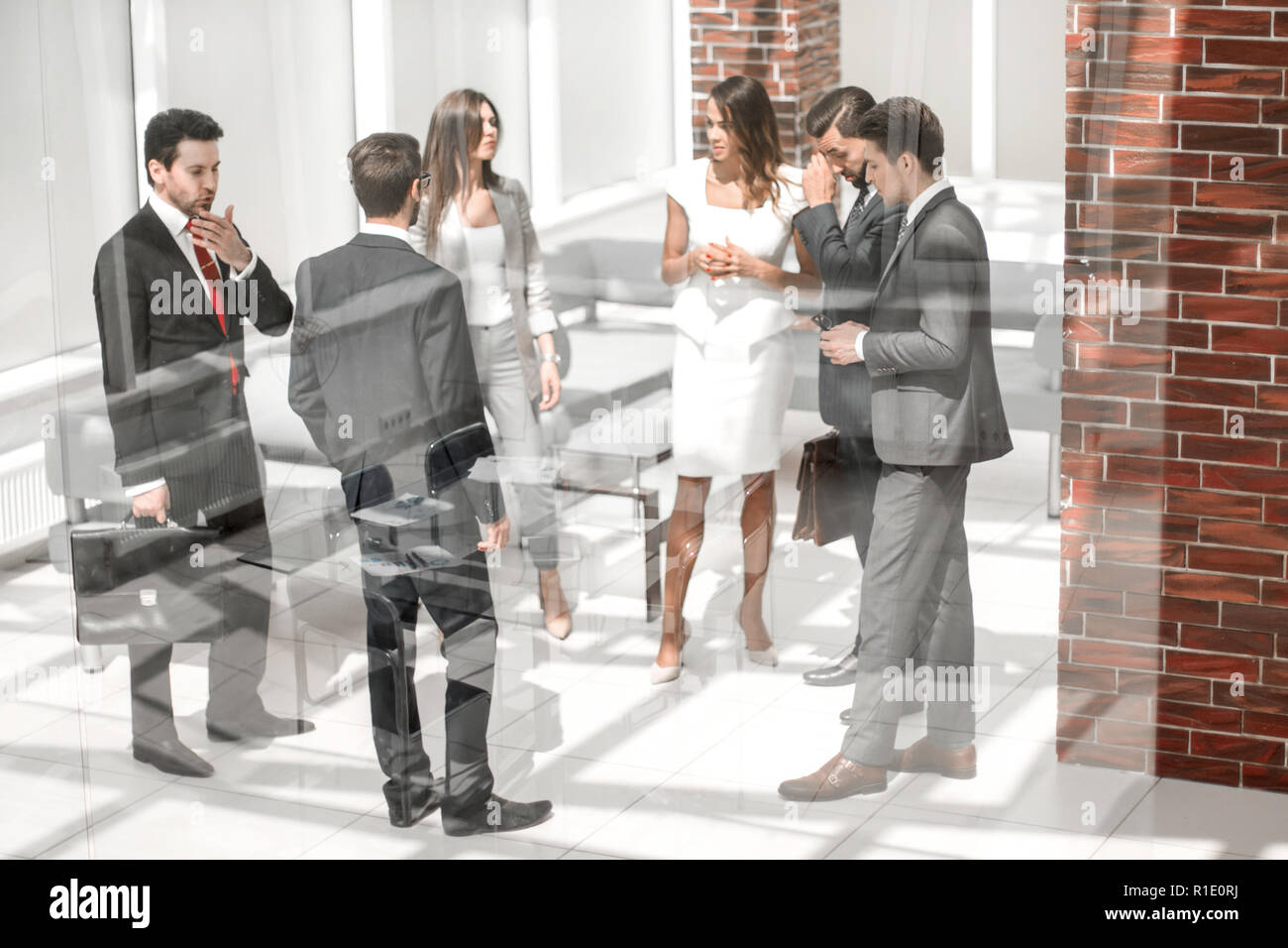 group of business people standing in the Bank hall Stock Photo - Alamy