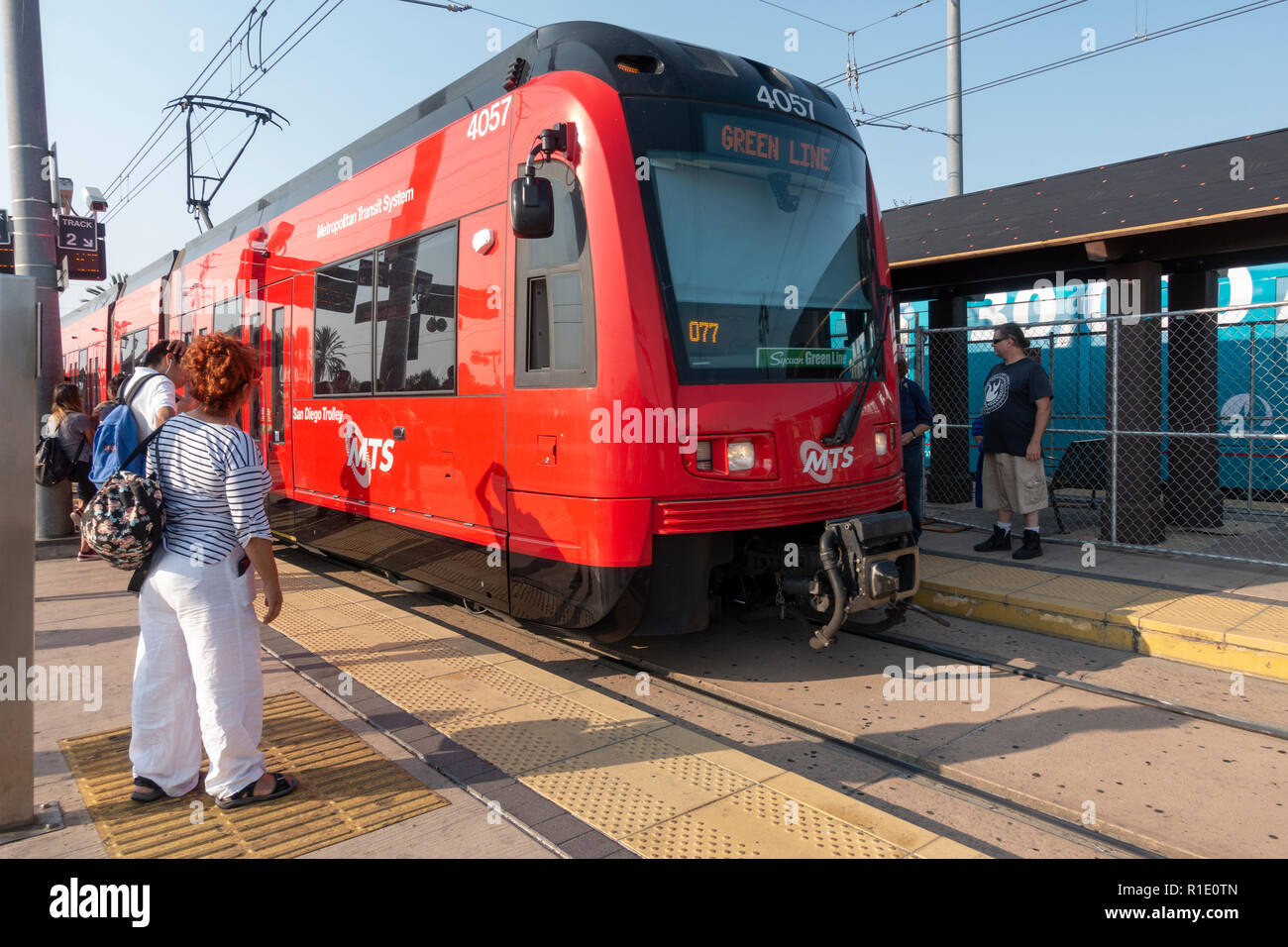 A Green Line MTS Trolley (San Diego Metropolitan Transit System) at a station in San Diego ...