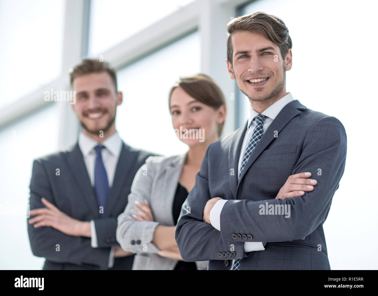 Young employees standing together hi-res stock photography and images ...