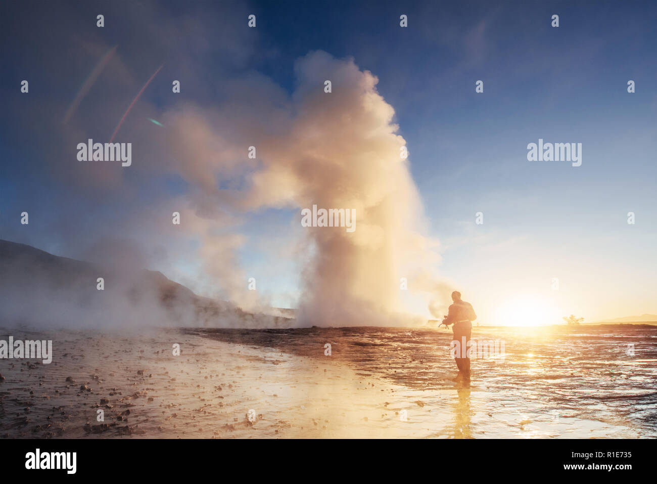 Eruption of Strokkur geyser in Iceland. Winter cold colors, sun ...