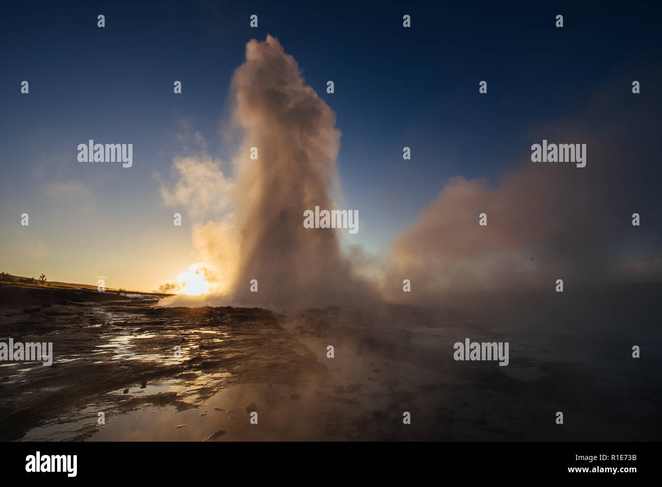 Strokkur geyser eruption in Iceland. Fantastic colors shine through the ...
