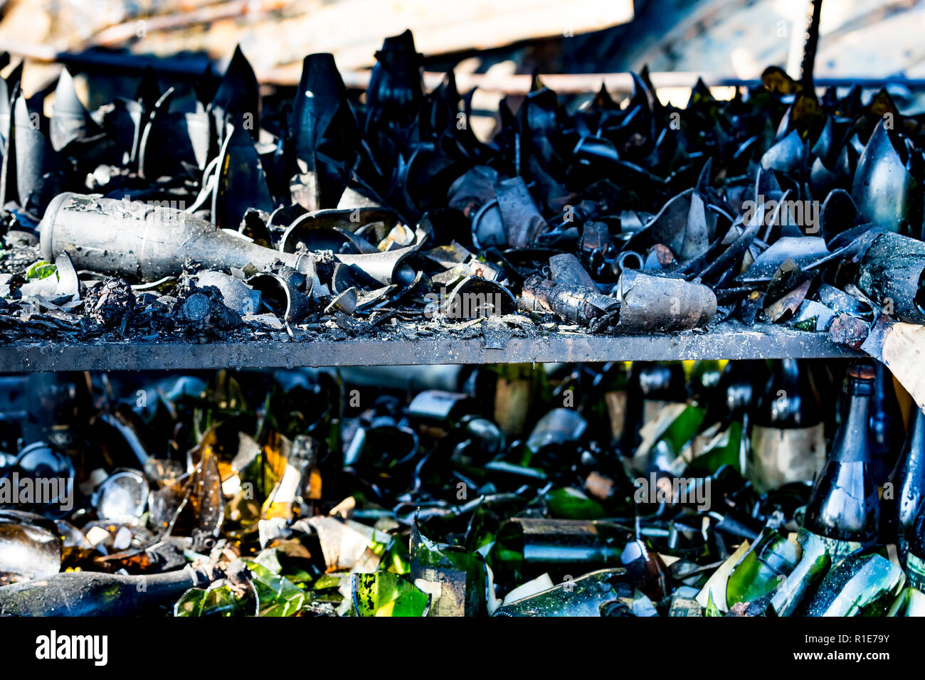 Close up damaged supermarket glass plastic bottles on shelves after ...