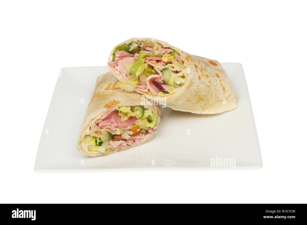 Ham salad wraps on a plate isolated against white Stock Photo - Alamy