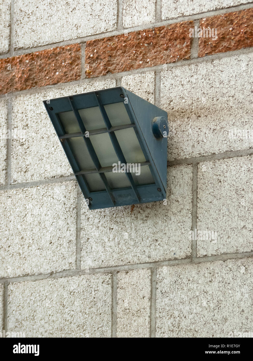 Wall-mounted black metal spotlight for security and illumination on an ...
