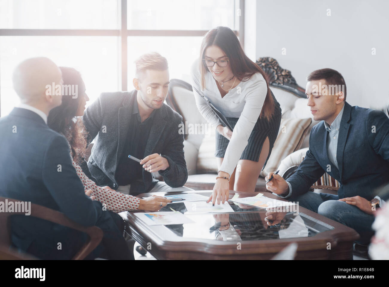 Young team of coworkers making great business discussion in modern ...