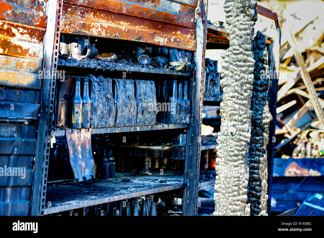 Close up damaged supermarket glass plastic bottles on shelves after ...