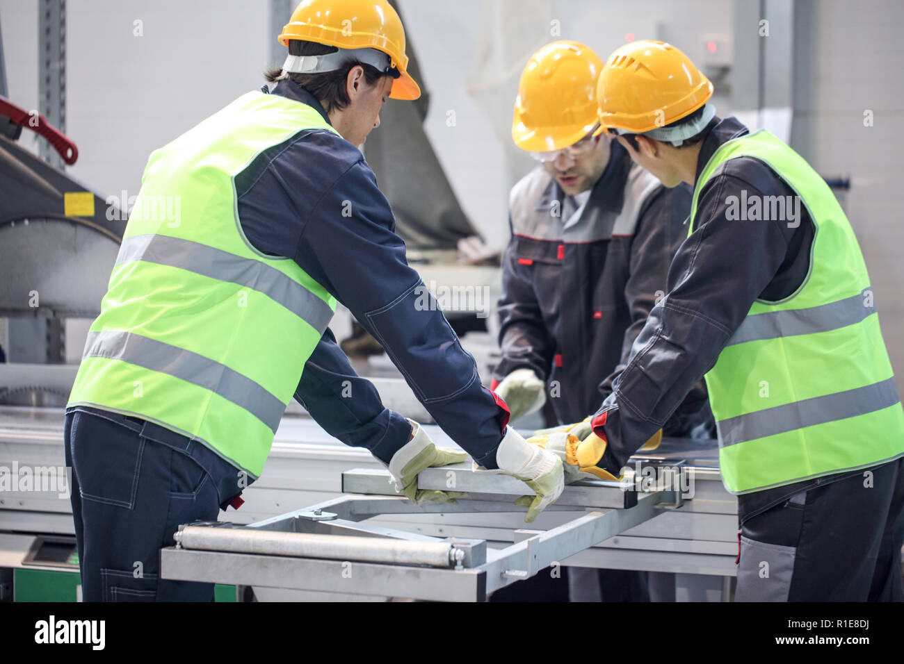 CNC machine shop with lathes, technicians and workers Stock Photo - Alamy