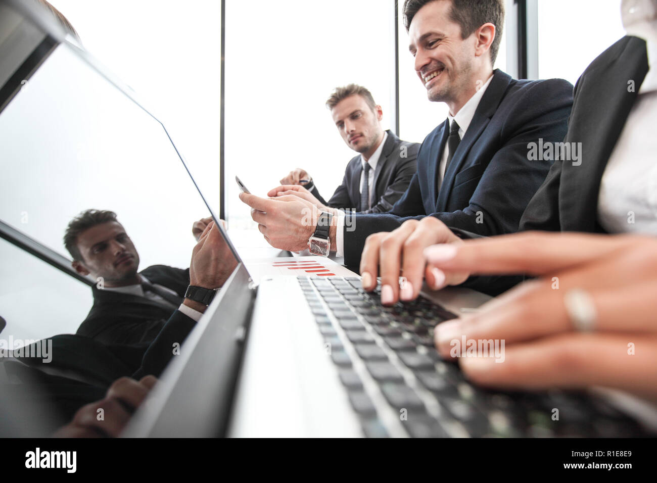Mixed group of people at business meeting working together with ...