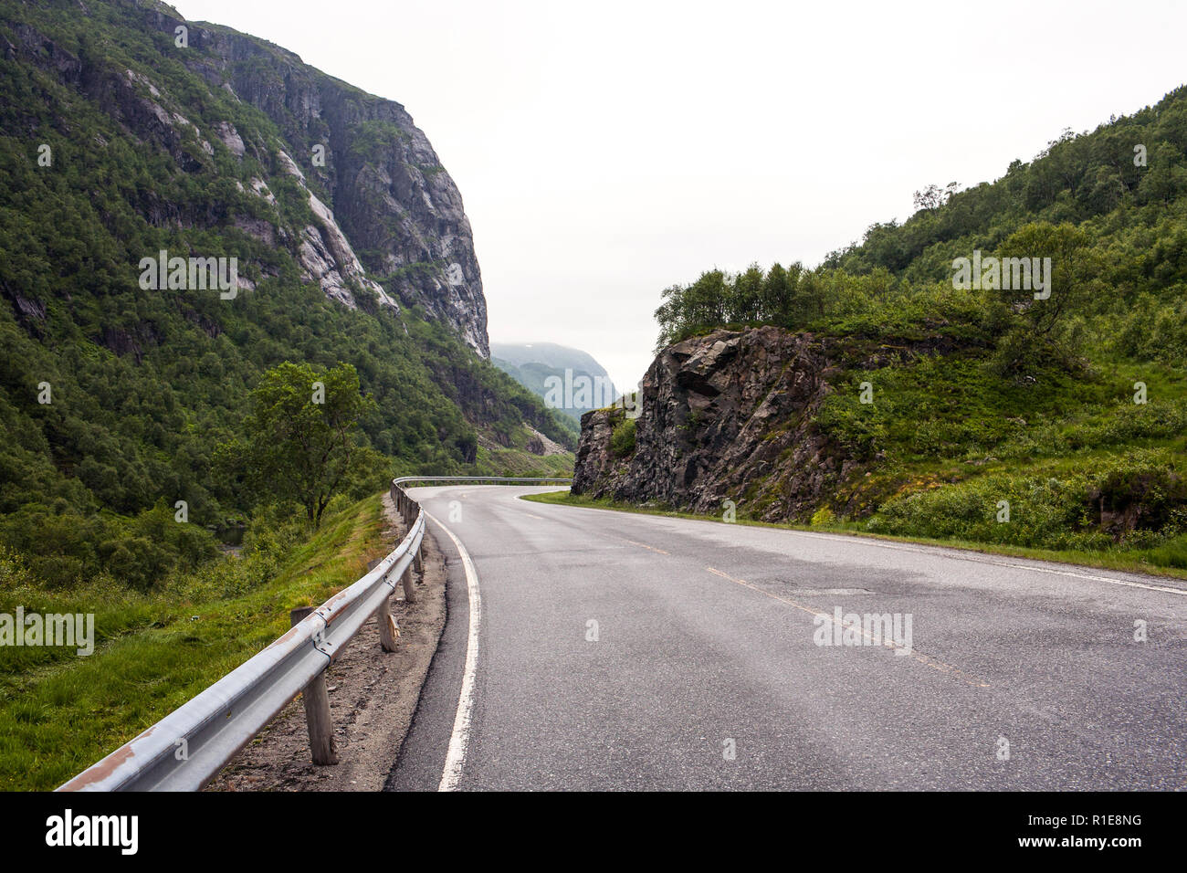 Mountain road. Landscape with rocks, sunny sky with clouds and ...