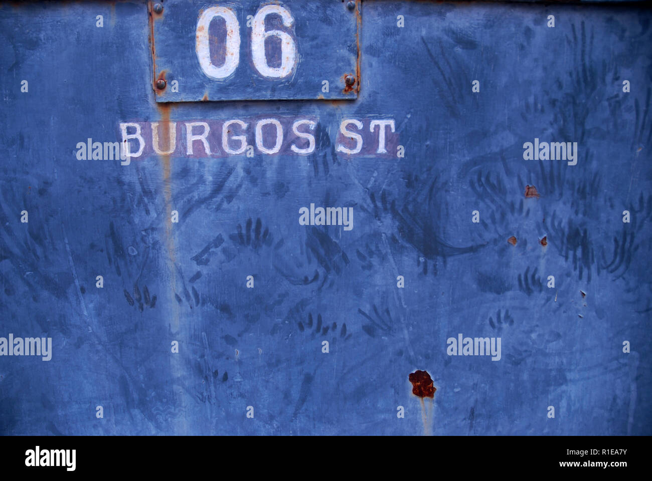 Painted blue front gate, 06 Burgos Street, Dumagette, Philippines Stock ...