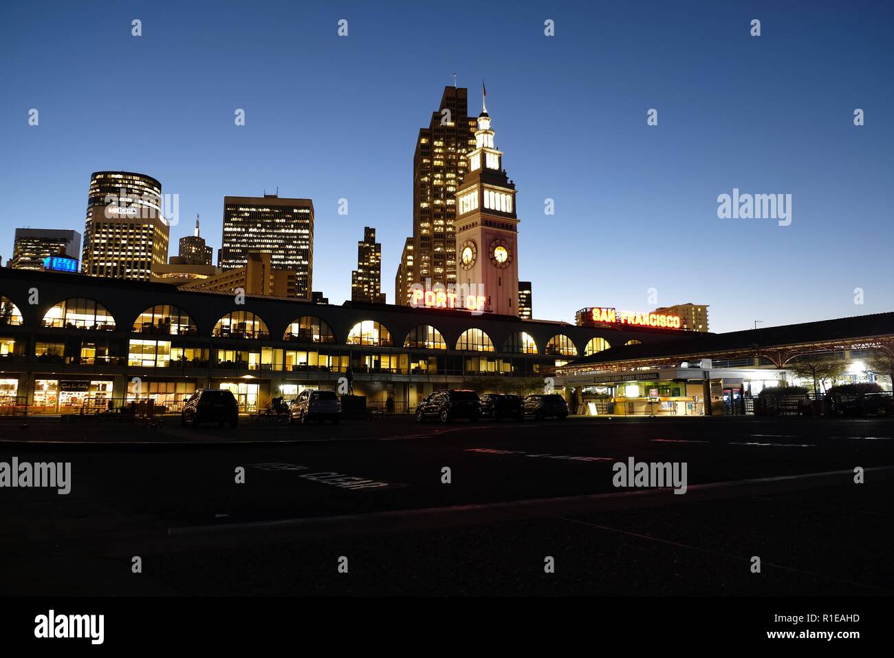 Port of San Francisco Ferry Building at night; clock tower and skyline ...