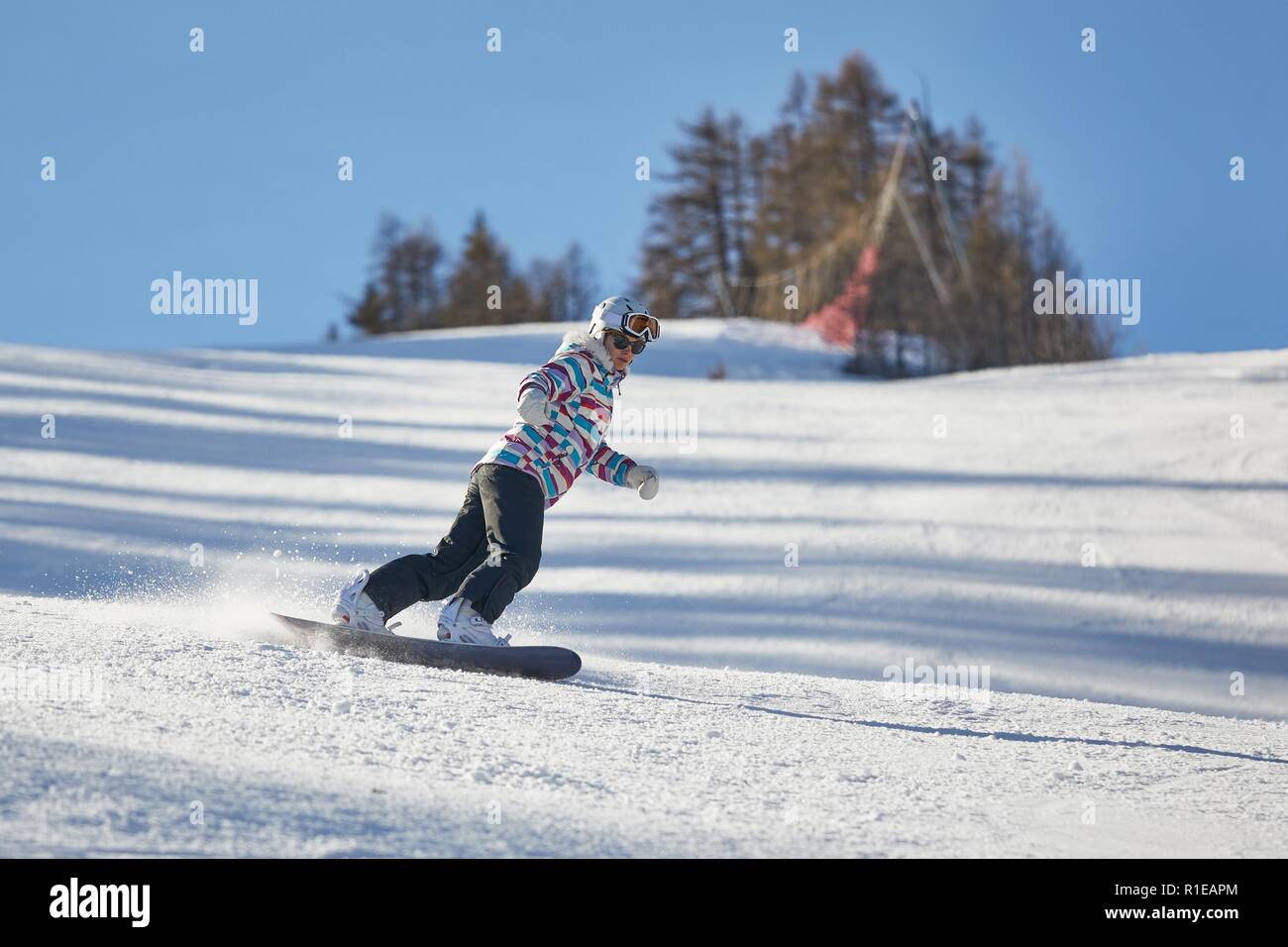 Female snowboarder on the slope Stock Photo - Alamy