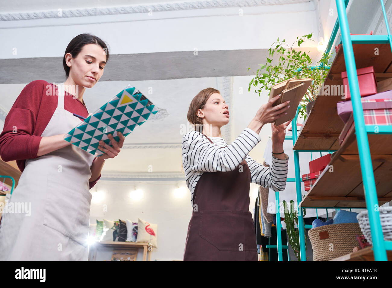 Women Decorating Store for Christmas Stock Photo - Alamy