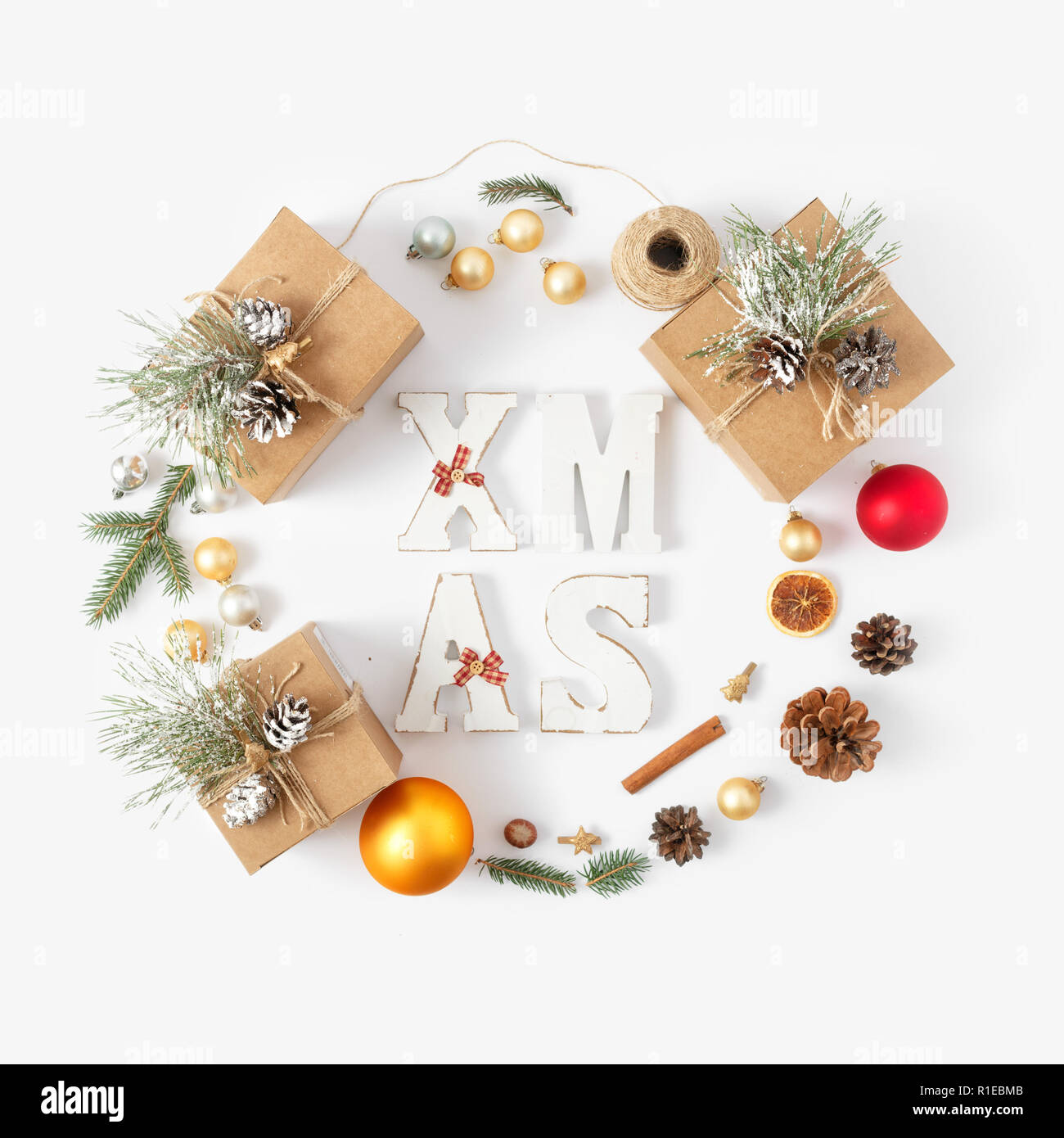 Flat lay Christmas background. Word Xmas and wreath made of Christmas ...