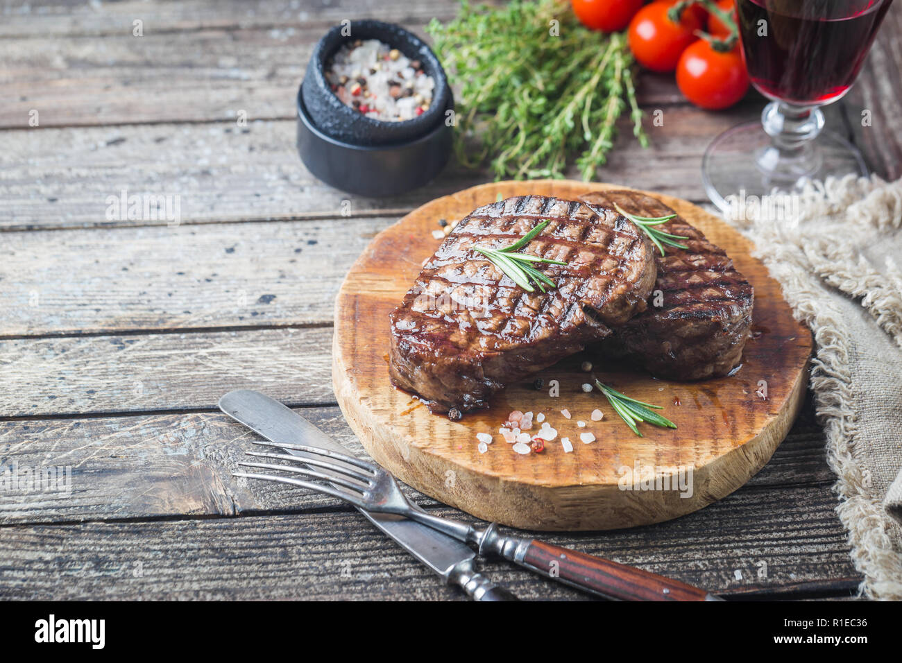 Grilled marbled meat steak Filet Mignon with seasonings. Juicy beef steak on cutting board Stock ...