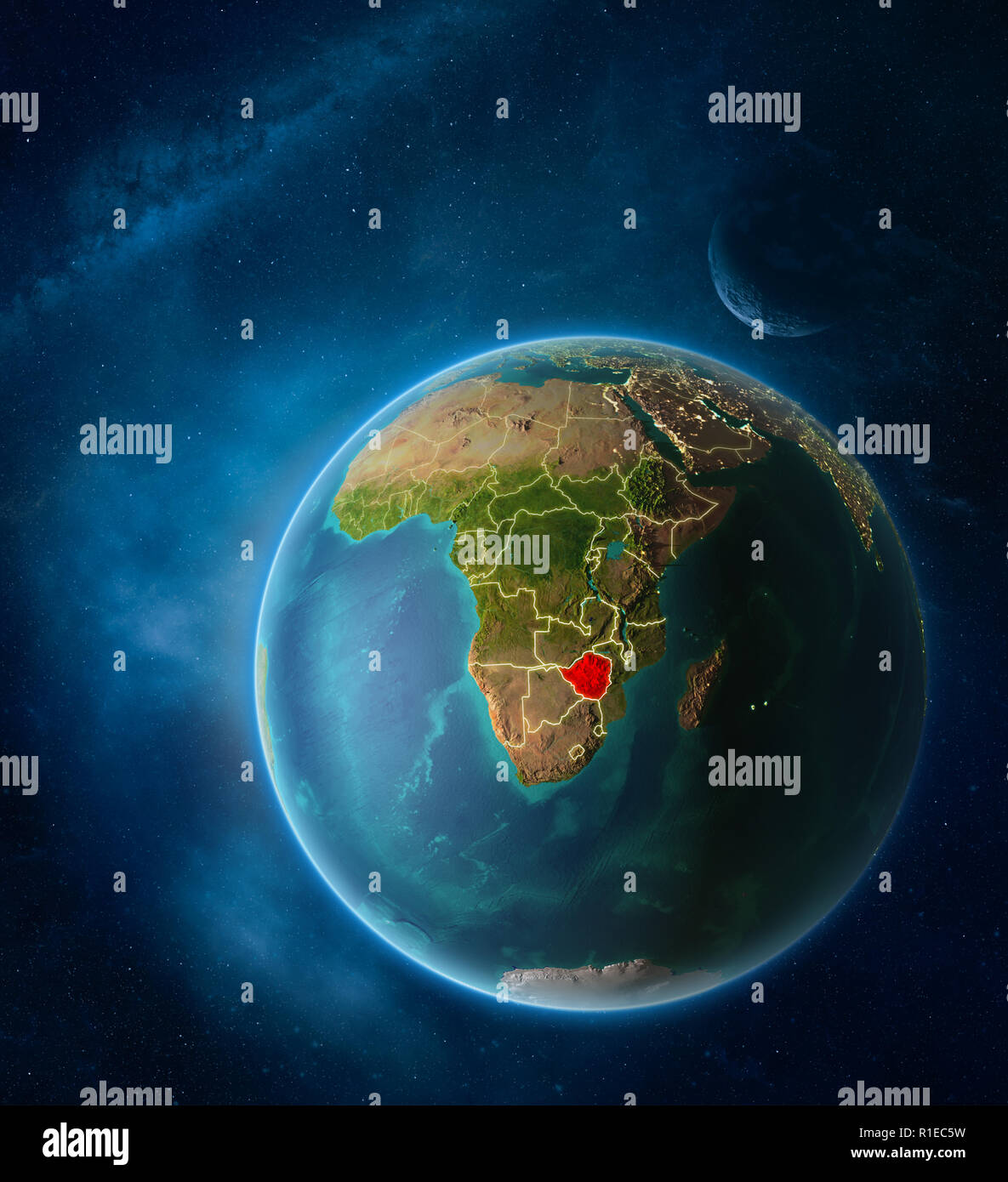 Planet Earth with highlighted Zimbabwe in space with Moon and Milky Way. Visible city lights and ...