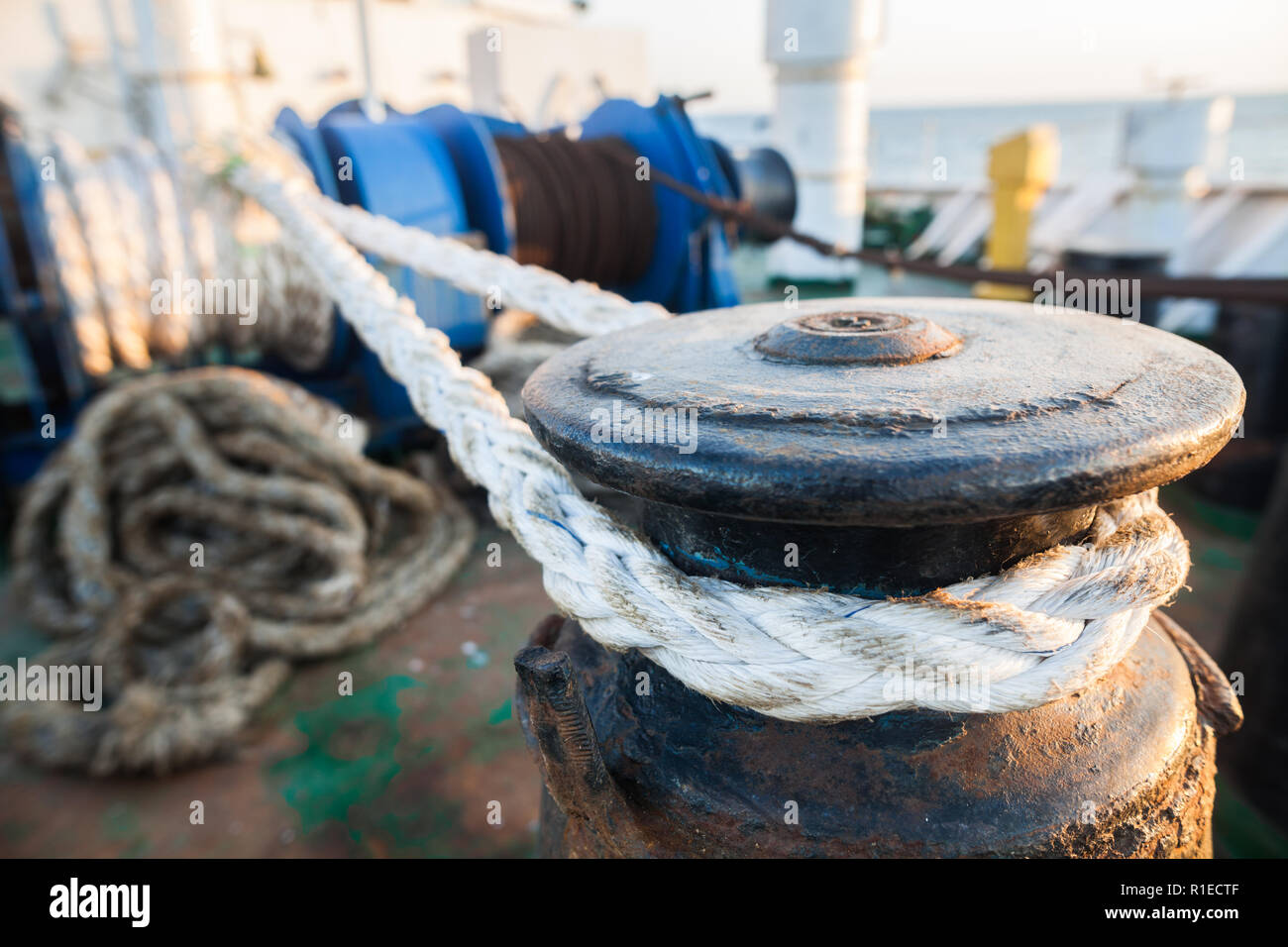 Mooring bollard on a ship with rope Stock Photo - Alamy