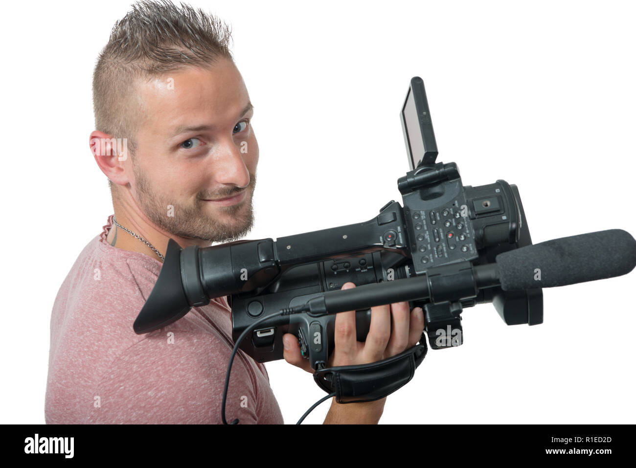 young man with professional camcorder isolated on white background ...