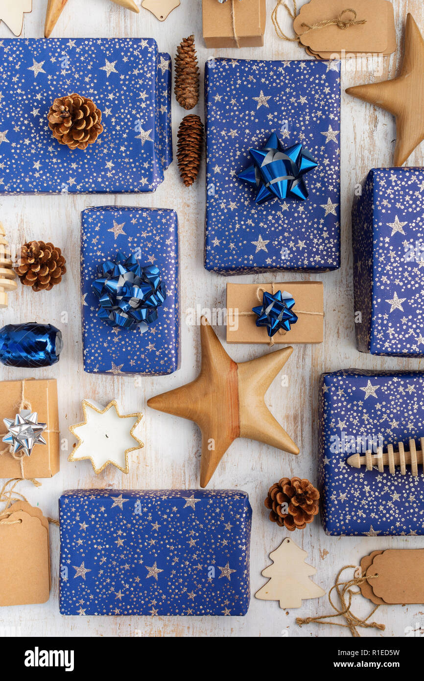 Creative chritmas arrangement. Presents in dark blue wrapping paper ...