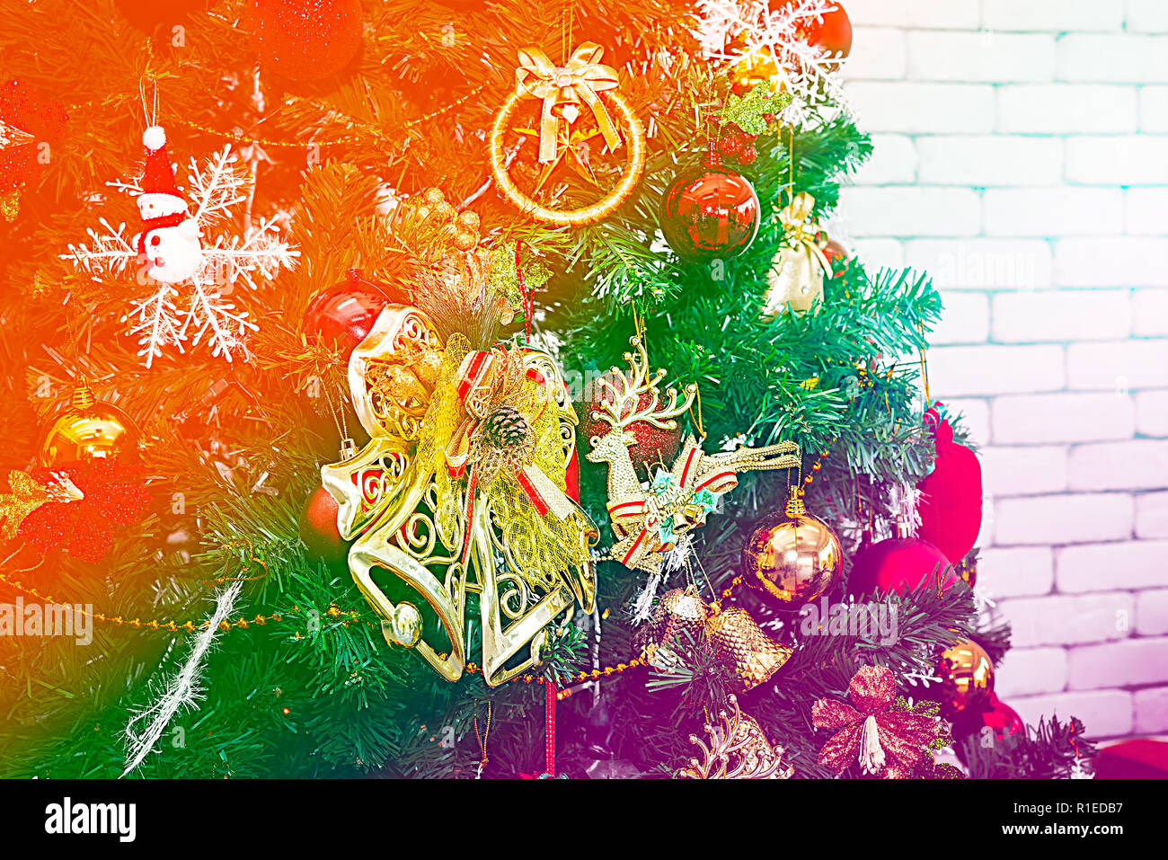Christmas scene with tree gifts and colorful background Stock Photo - Alamy