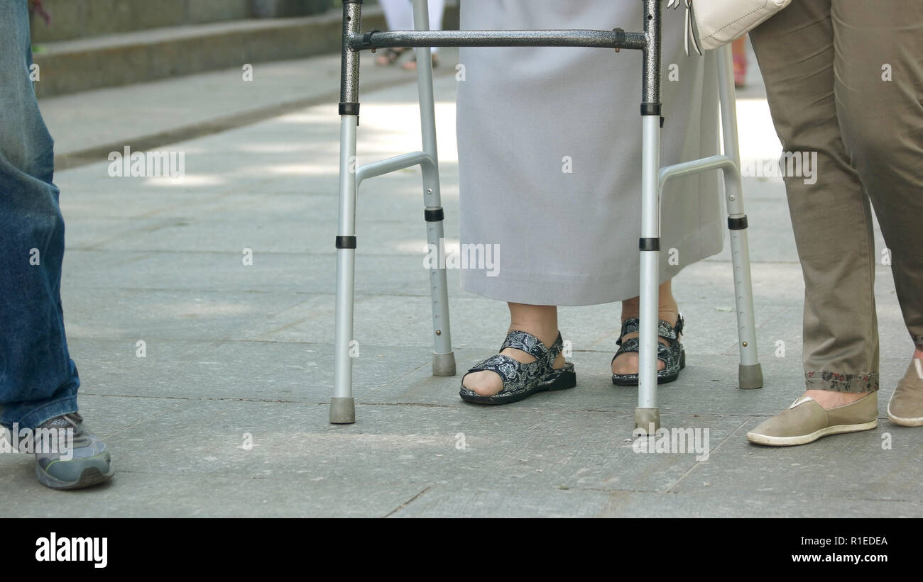 Elderly lady using walking aid hi-res stock photography and images - Alamy