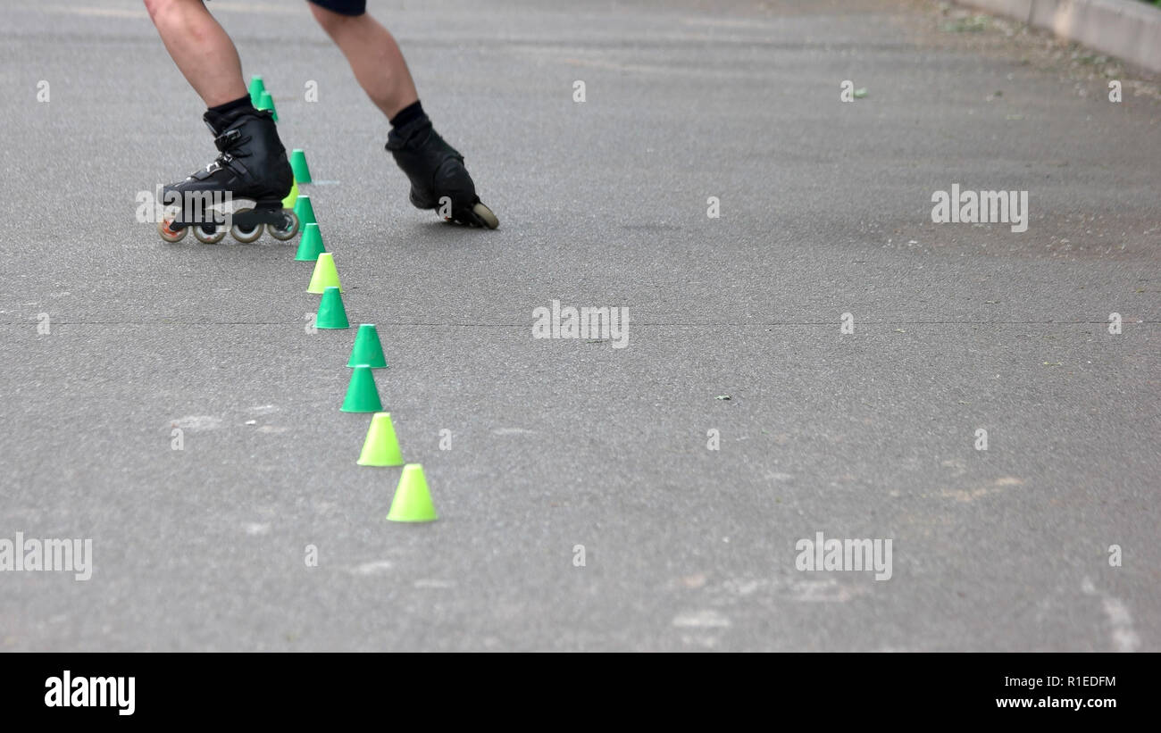 Boy riding on roller skates outdoor Stock Photo - Alamy