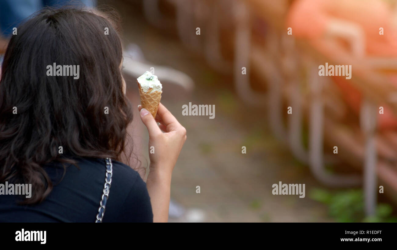 Woman eating ice cream fat hi-res stock photography and images - Alamy