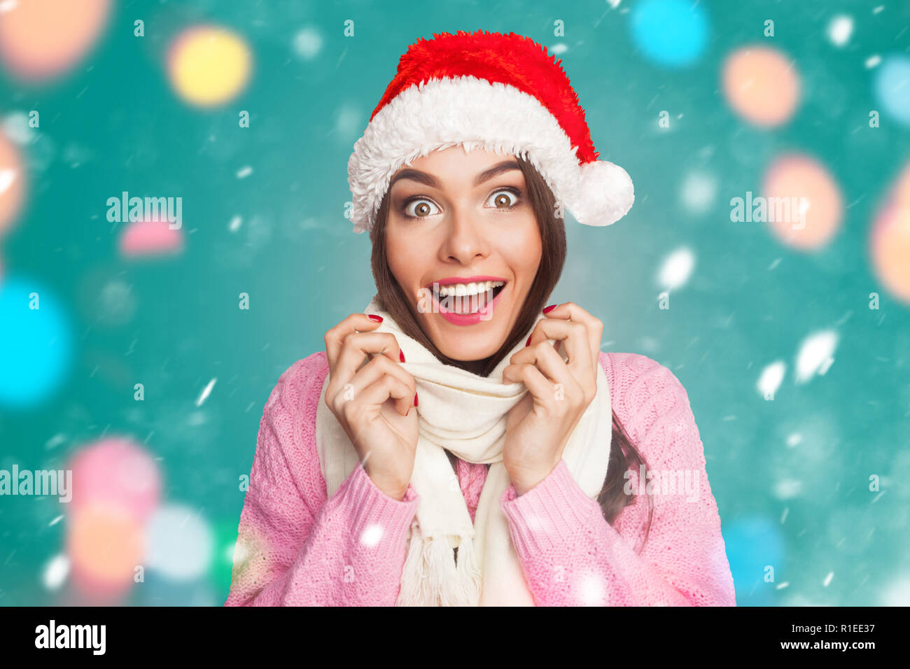 Beautiful woman wearing christmas hat hi-res stock photography and ...