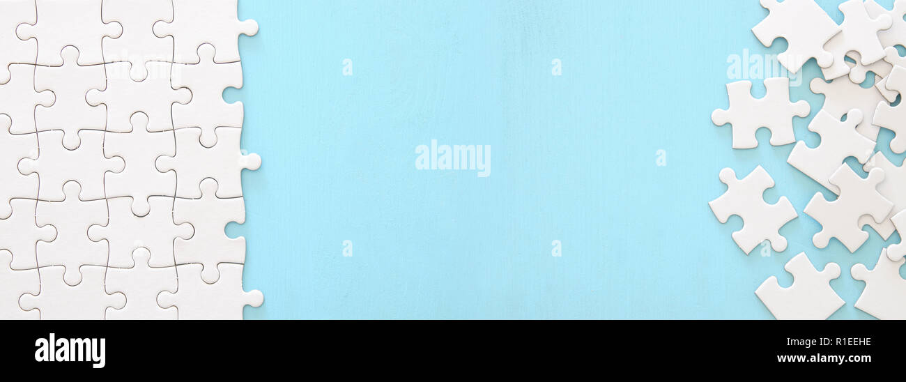 background of white puzzle with missing piece. Banner Stock Photo - Alamy