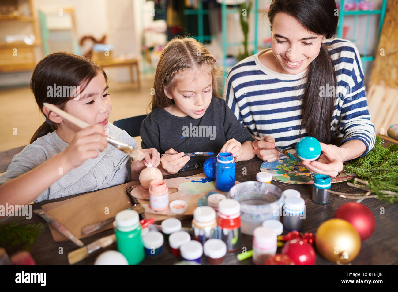 Two Girls Making Handmade Ornaments Stock Photo - Alamy