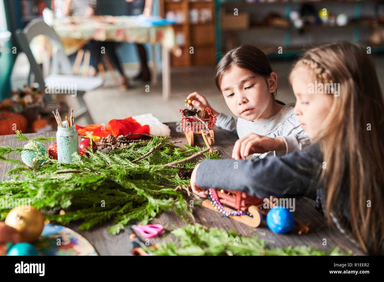Cute Girls Making Christmas Presents Stock Photo - Alamy