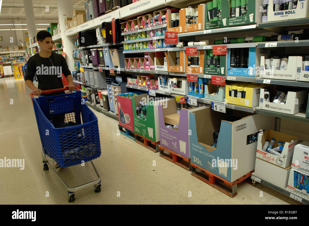 A boy shopping in a supermarket,with a trolley Stock Photo - Alamy