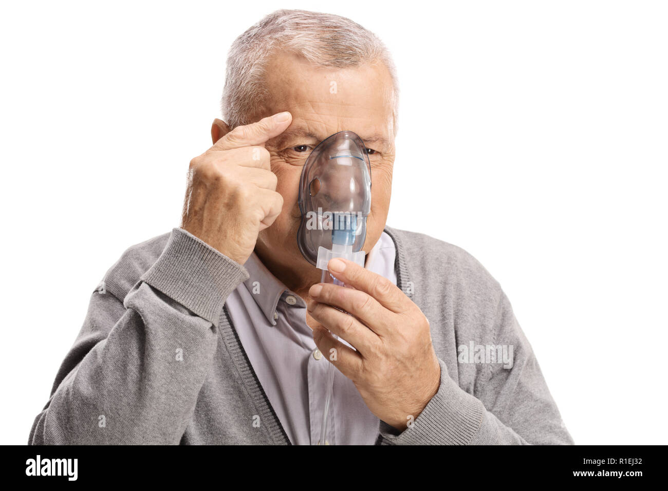 Elderly man using an inhalation mask isolated on white background Stock ...